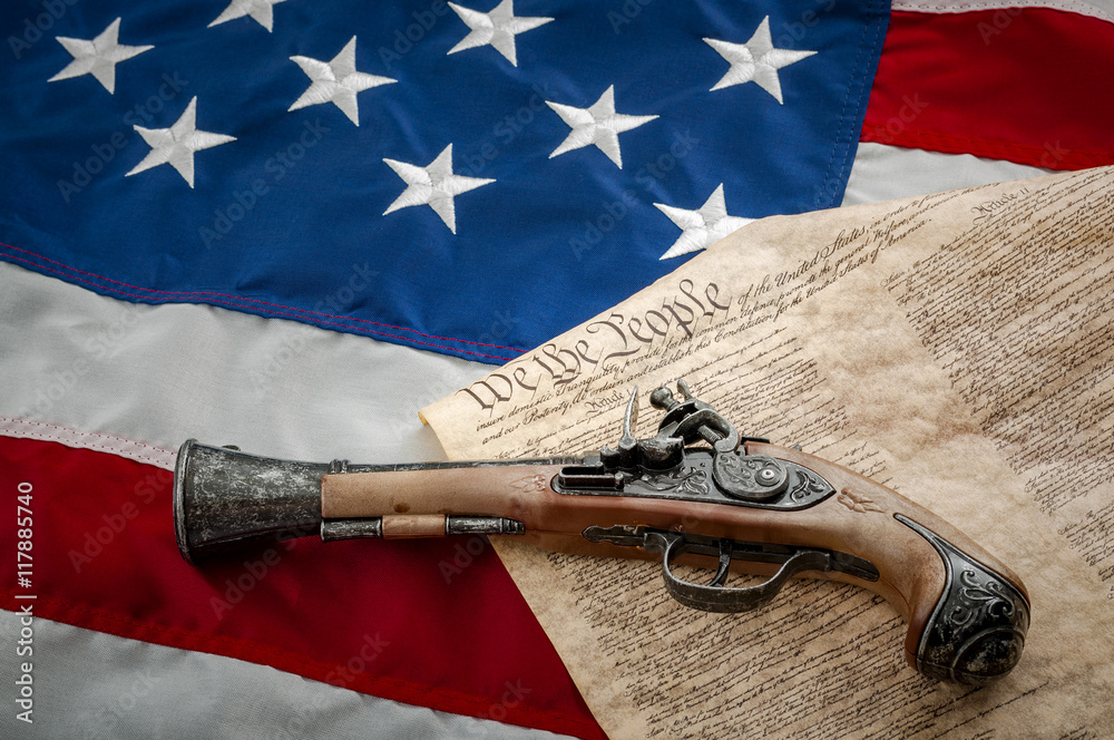American flag, US constitution and a musket type pistol or a flint ...