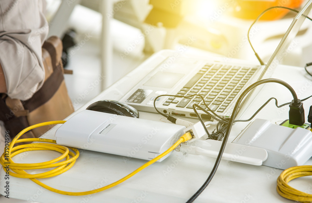man working design Installing wireless devices. Stock Photo | Adobe Stock