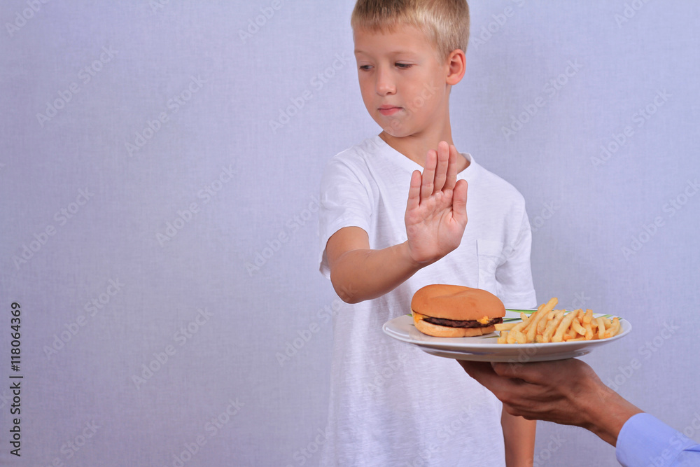 Child refuses to eat unhealthy fast food. Healthy eating and active ...