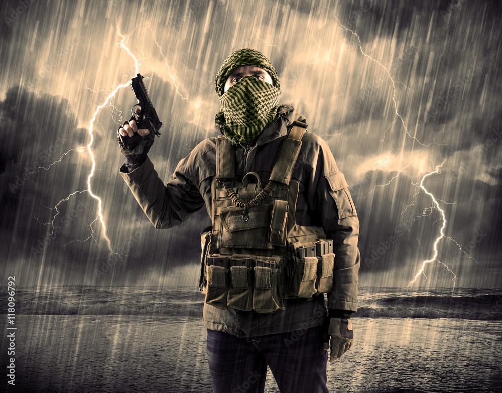 Dangerous armed terrorist with mask and gun in a thunderstorm wi Stock ...