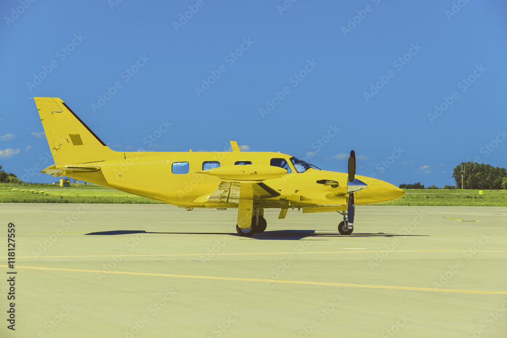 Yellow propeller plane parking at the airport Stock Photo | Adobe Stock