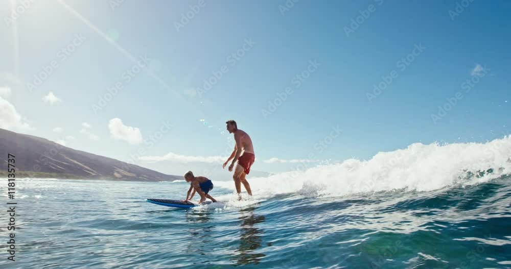 Father and son having fun surfing together, summer lifestyle family ...