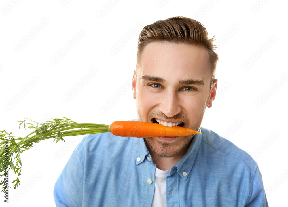 Handsome man eating carrot, isolated on white Stock Photo | Adobe Stock