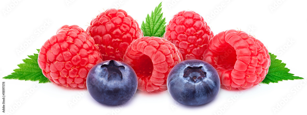 Five ripe raspberries in a line with two blueberries and green leaves ...