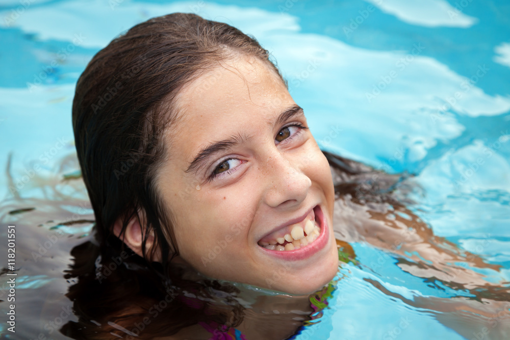 Happy Tween Girl In Swimming Pool Stock Photo | Adobe Stock