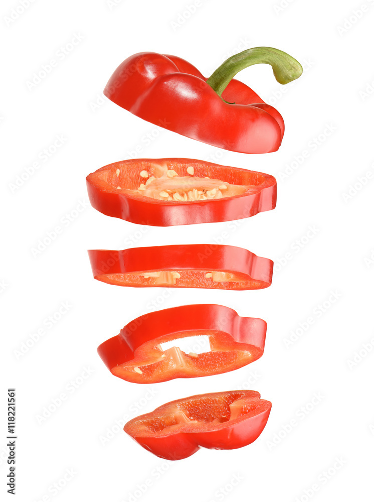 sliced and falling red pepper isolated on white background Stock Photo ...