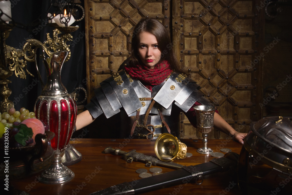 Beautiful woman in roman helmet and armour Stock Photo | Adobe Stock