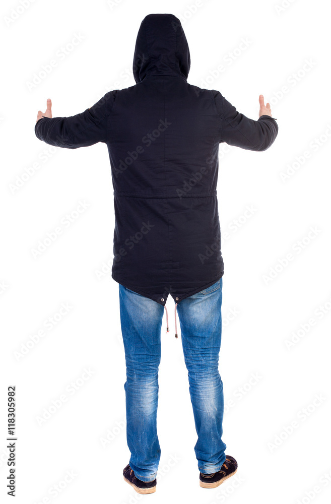 Back view of man. Raised his fist up in victory sign. Rear view people ...