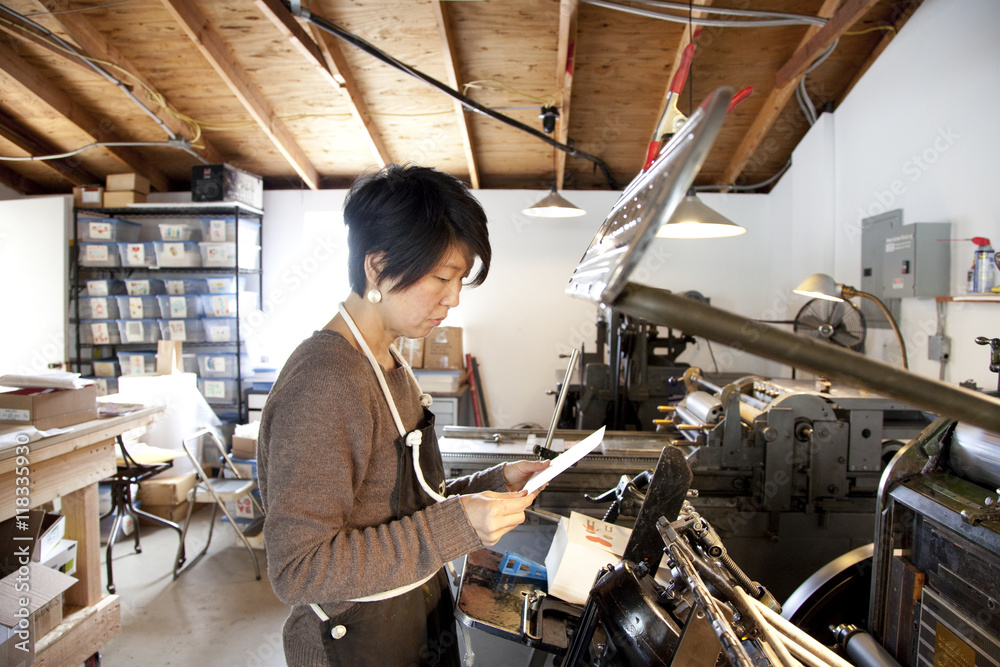Japanese entrepreneur working in print shop Stock Photo | Adobe Stock