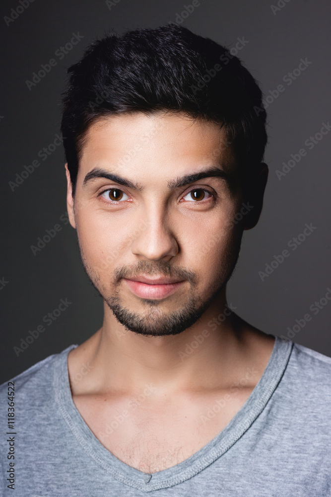 Portrait of a normal boy over grey background / Attractive young Stock ...