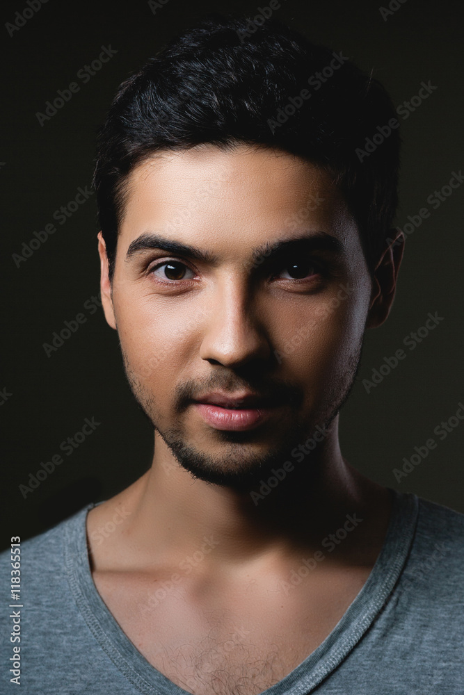 Portrait of a normal boy over grey background / Attractive young Stock ...