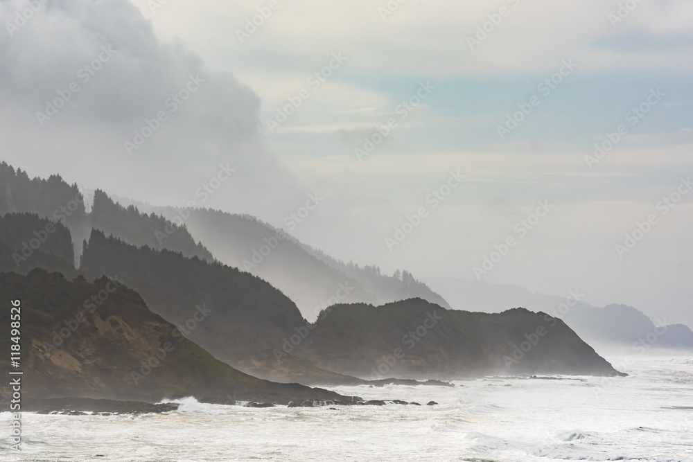 Misty and Foggy Oregon Coast cliffs and forests with stormy sky and ...