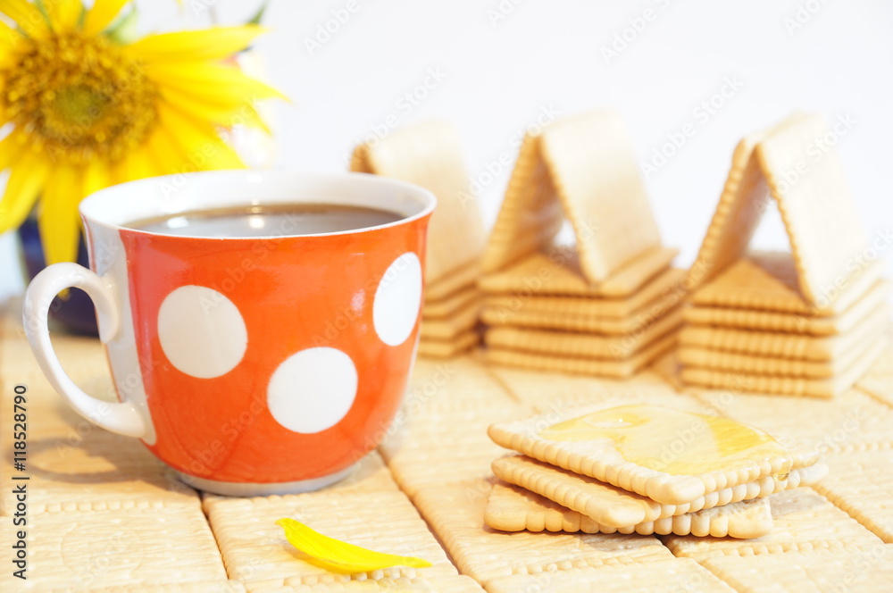 Sponge cake with honey. House crackers. Still crackers and a cup of ...