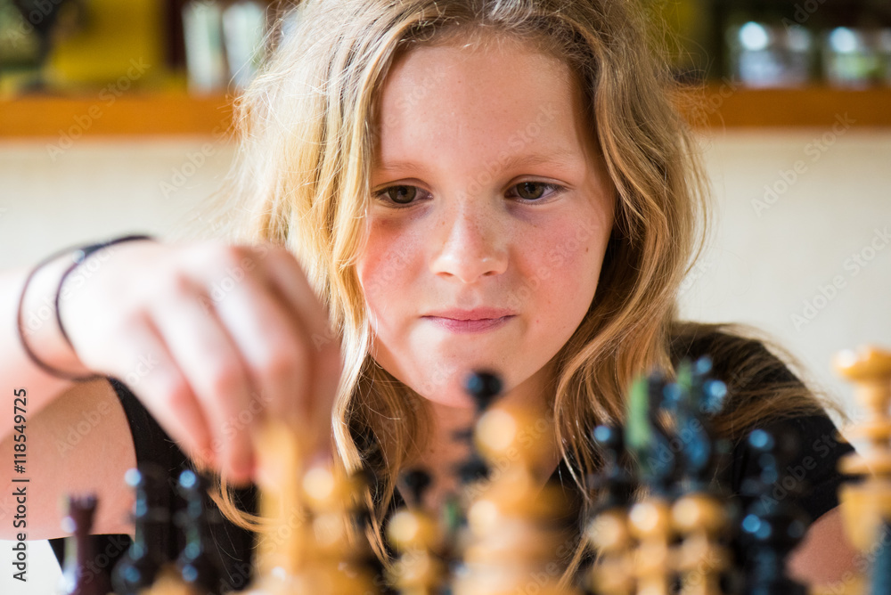 young girl playing chess Stock Photo | Adobe Stock