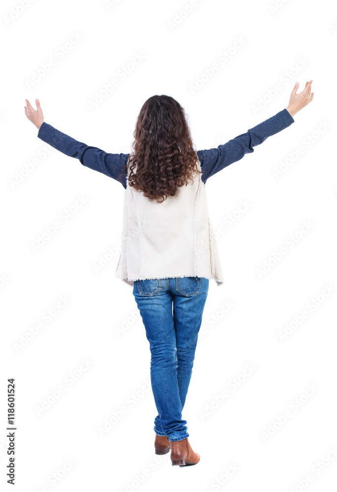 Back view of beautiful woman welcomes. Young teenager girl in jeans ...