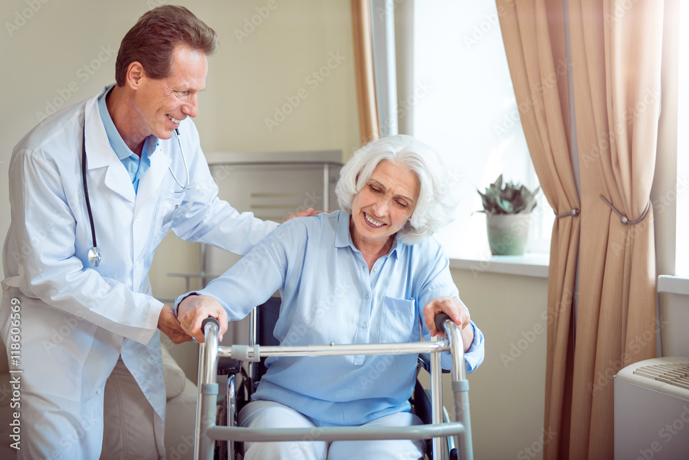 Young doctor helping female patient Stock Photo | Adobe Stock