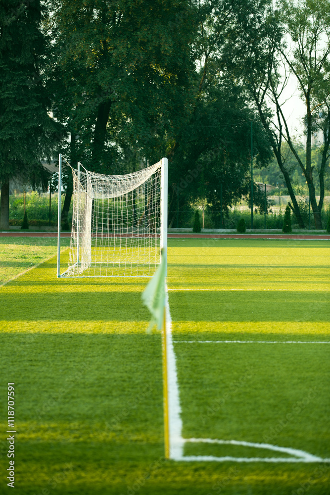 right side view of standard goal and net in football pitch or soccer ...