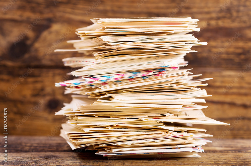stack of envelopes on wooden background Stock Photo | Adobe Stock