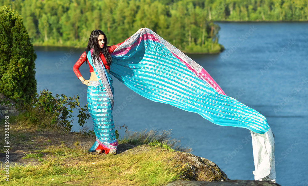 Arabic woman outdoor portrait with flying sari scarf Stock Photo ...