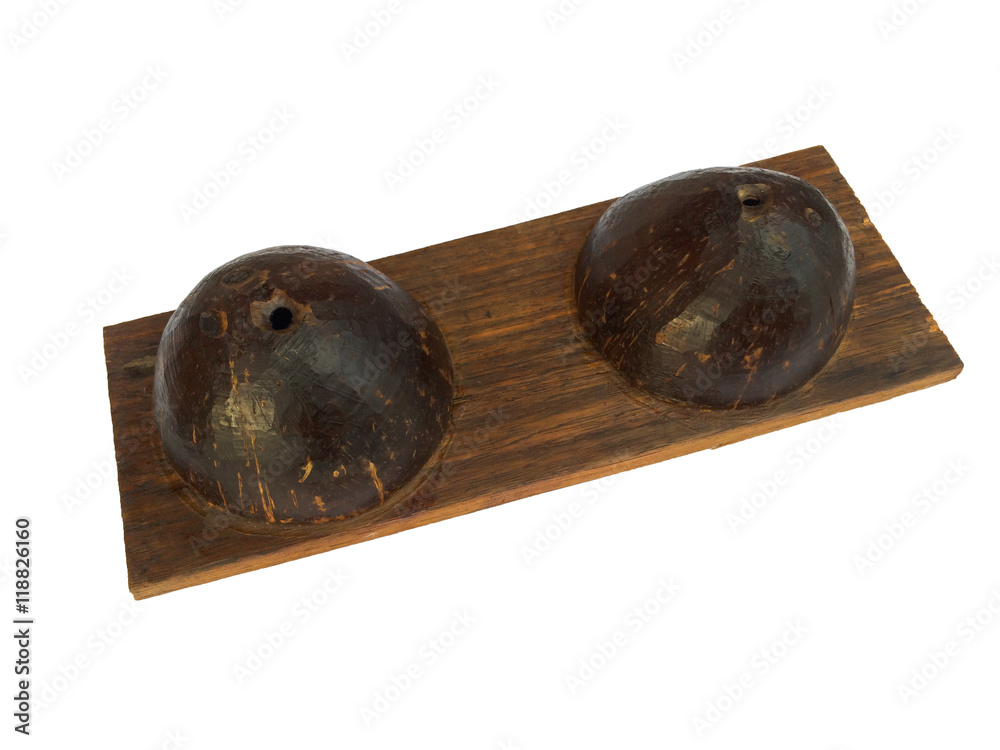 Foot massage device made from coconut shells isolated on white ...
