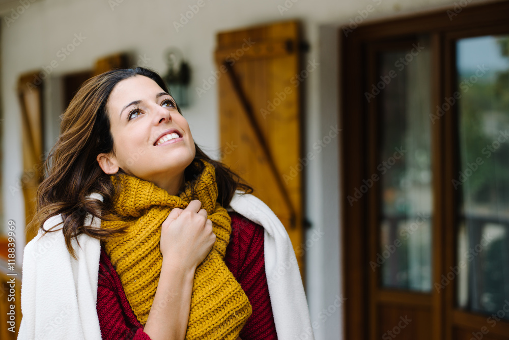 Relaxed woman wearing warm clothes and blanket on cold autumn ...