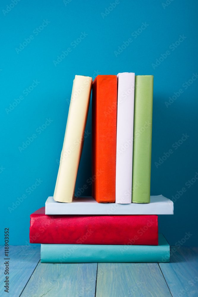 Book in library on blue wooden shelf. Education background with copy ...