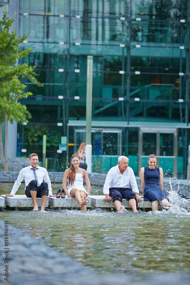 Business team splashing water in summer Stock Photo | Adobe Stock
