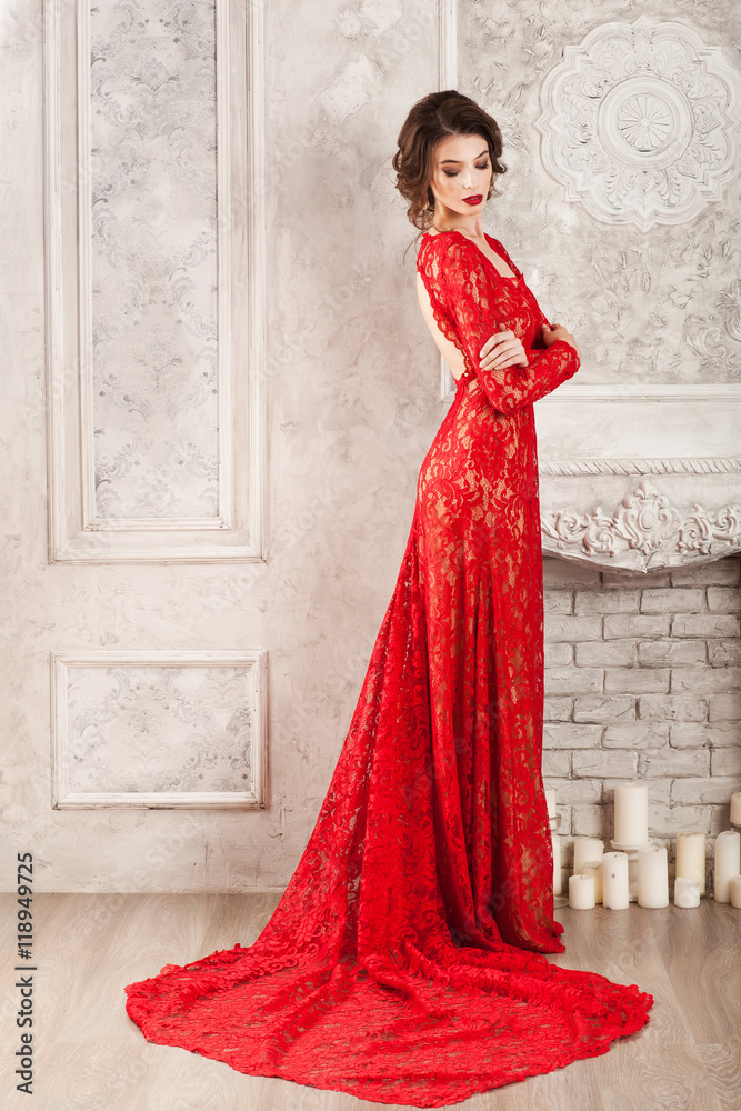 Beautiful young girl in red dress, indoor Stock Photo | Adobe Stock