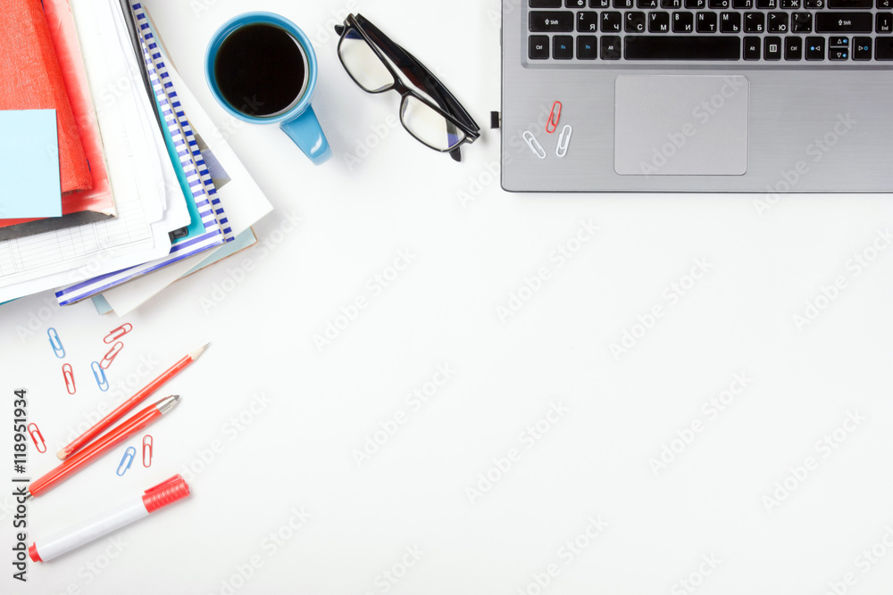 Office table desk with supplies, blank note pad, cup, pen, pc, crumpled ...