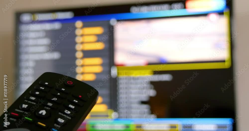 Changing channels of a TV with a remote control Stock Video | Adobe Stock