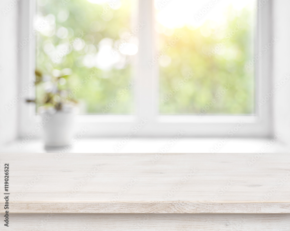 Wooden table on defocused summer window with flower pot background ...