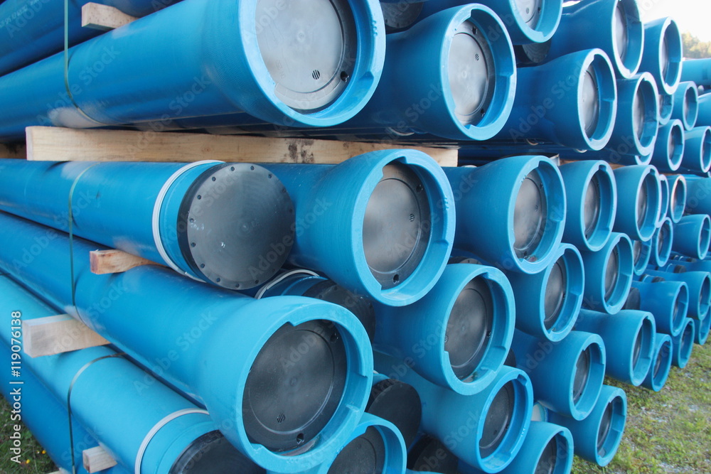 Blue PVC plastic pipes and fittings used for underground water supply ...