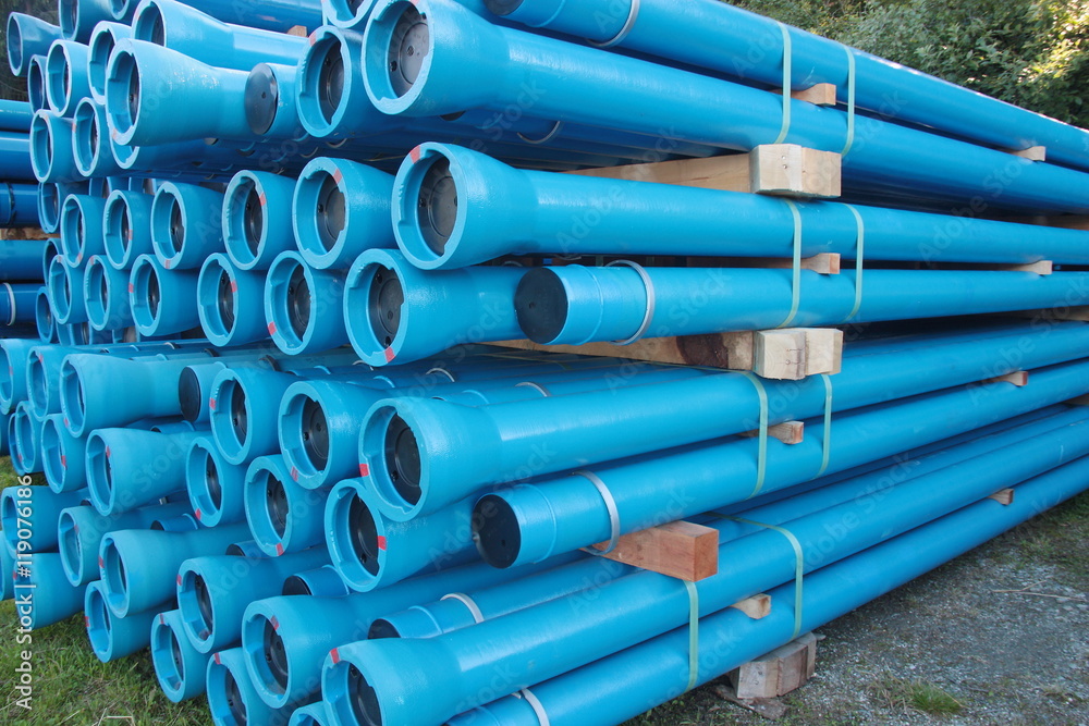 Blue PVC plastic pipes and fittings used for underground water supply ...