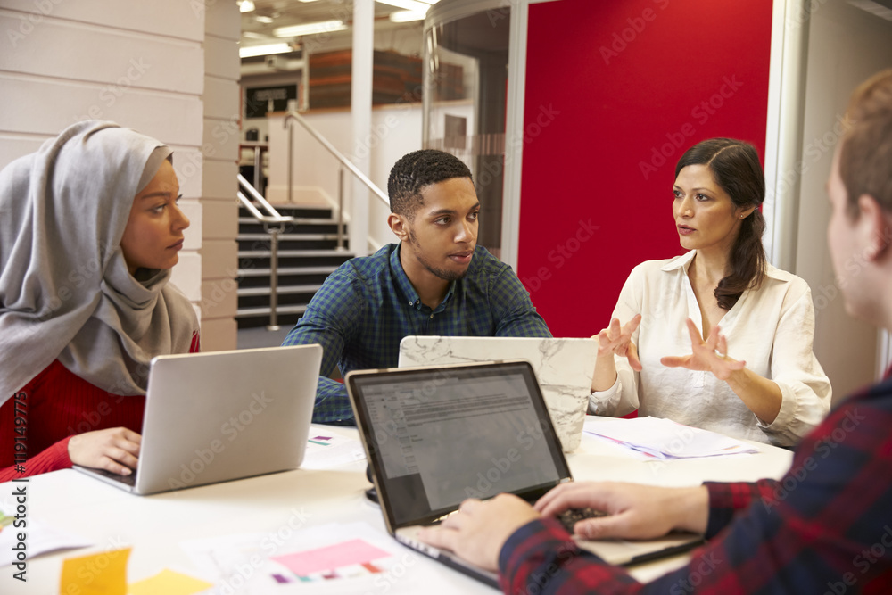 Group Of Students Meeting For Tutorial With Teacher Stock Photo | Adobe ...