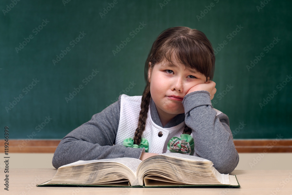 Girl in the classroom. Great tutorial, blackboard. Child obesity full ...