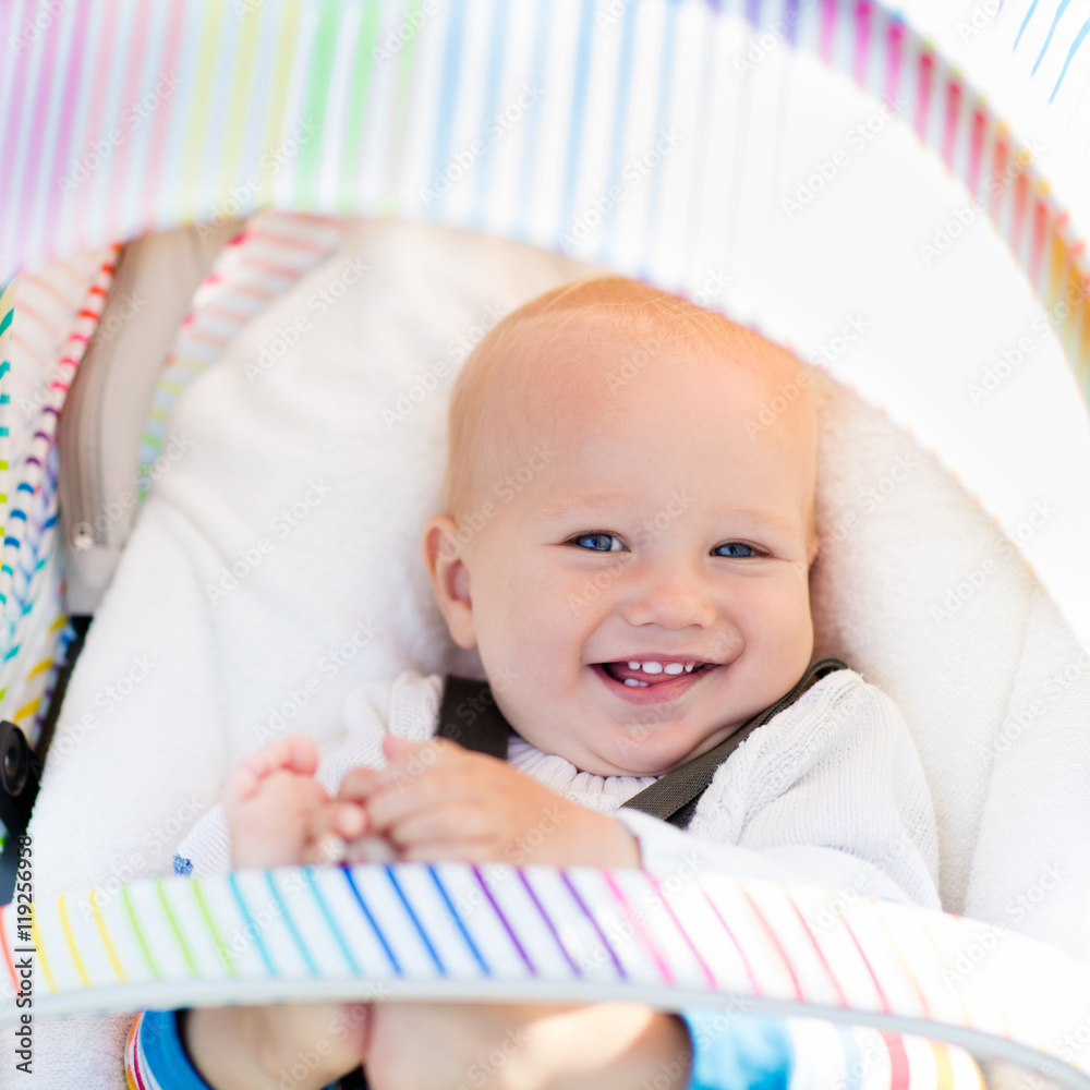 Baby in white stroller Photos | Adobe Stock
