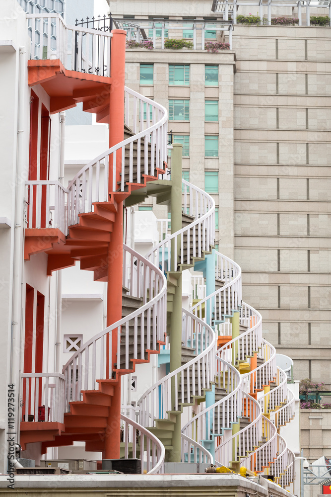 Colorful spiral staircases at the back of traditional Chinese shop ...