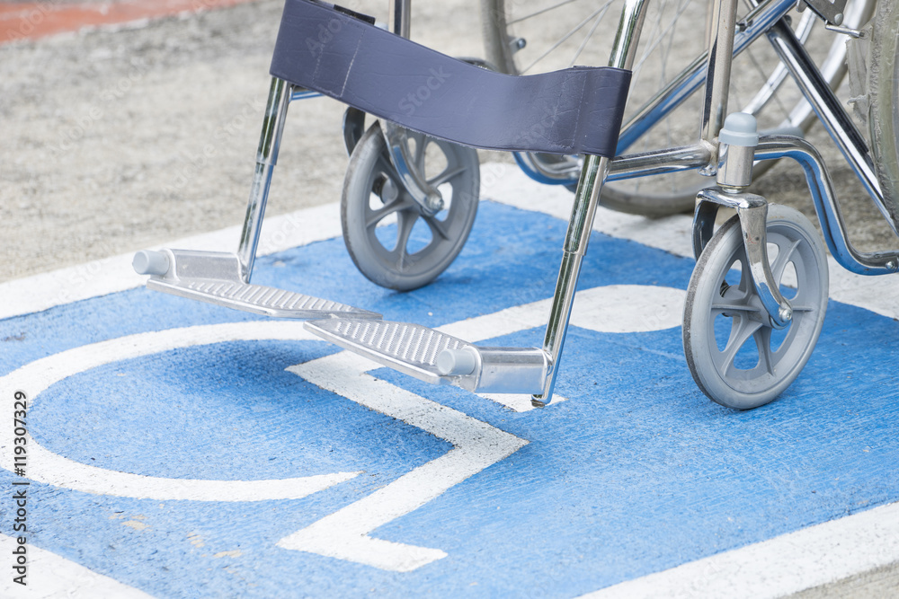 Pavement handicap symbol and wheelchair Stock Photo | Adobe Stock