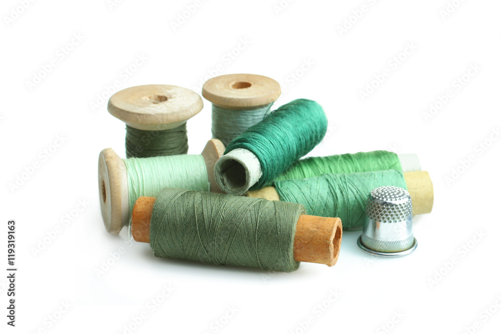 Spool of thread on isolated white background Stock Photo | Adobe Stock