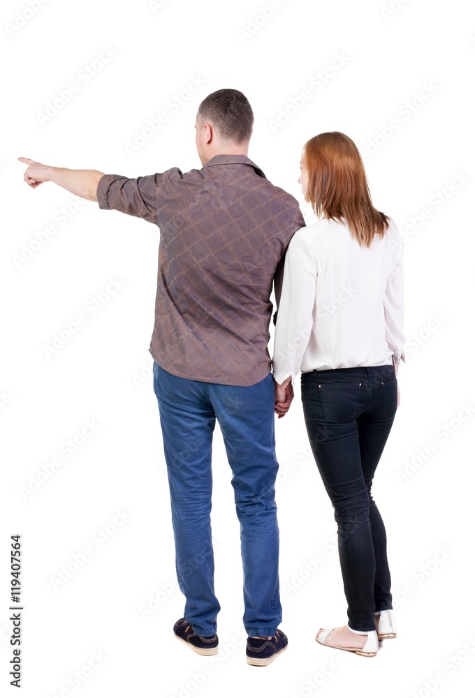 young couple pointing. Back view. Rear view people collection. backside ...