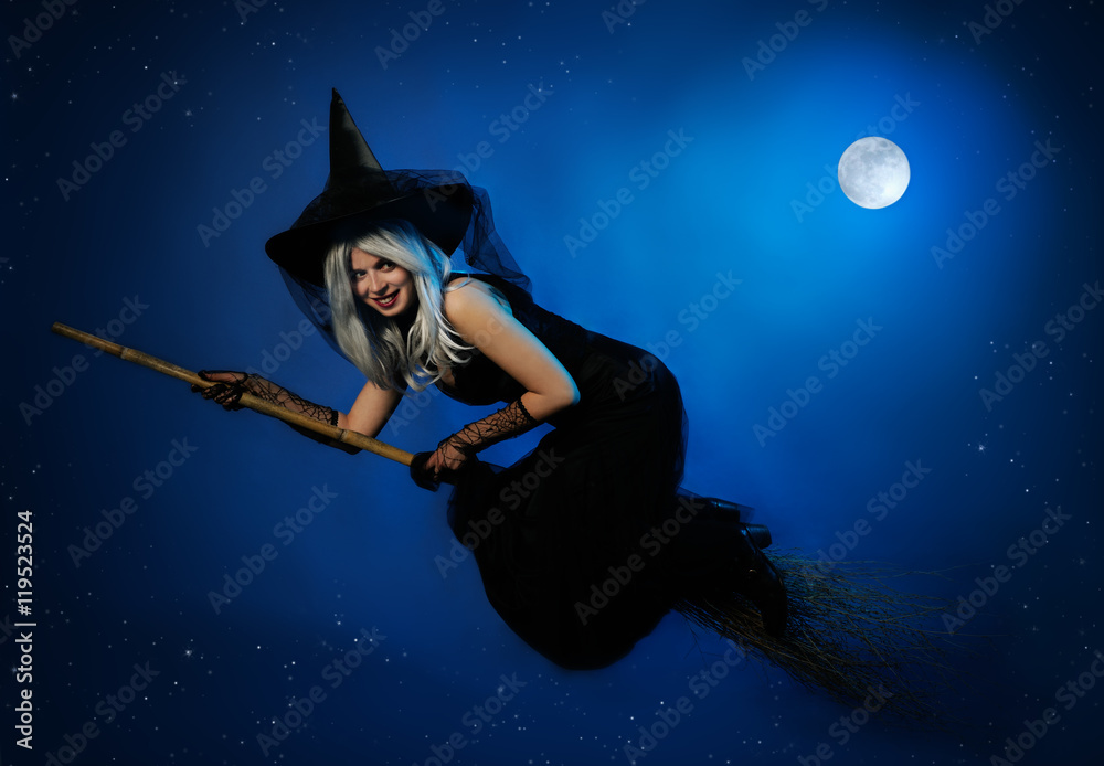 flying witch with a broom Stock Photo | Adobe Stock