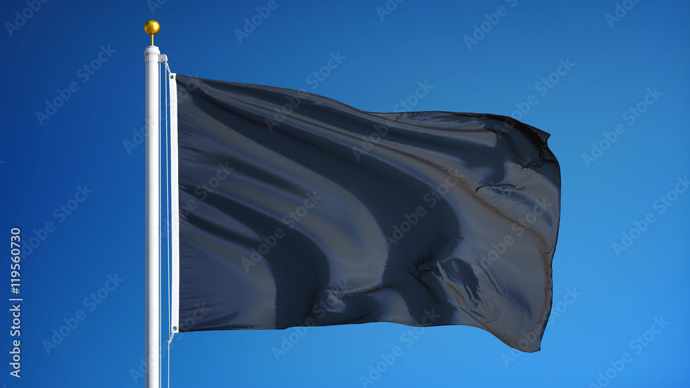 Dark black flag waving against clean blue sky, close up, isolated with ...