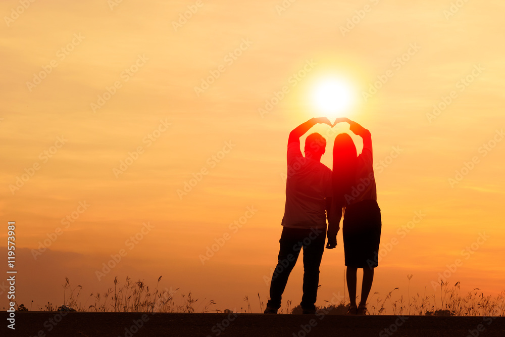 Couple Holding Hands In The Sunset Wallpaper
