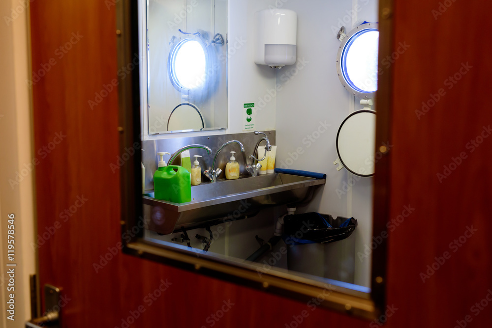 Bathroom on a ship taken through the window of the bathroom door. Stock ...