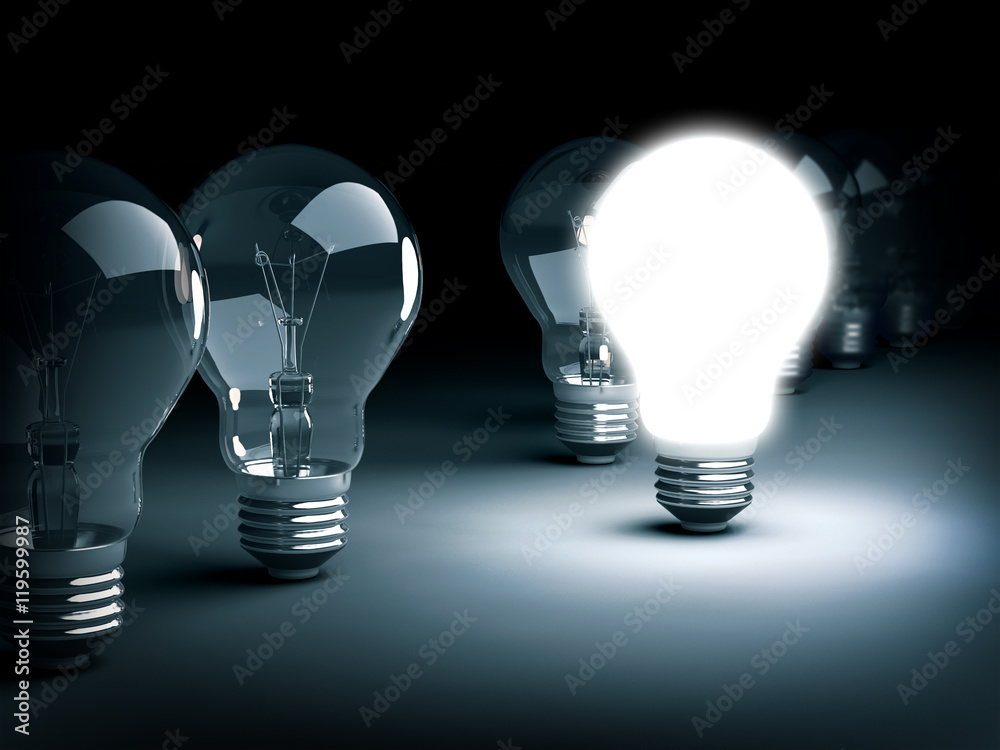 Illuminated light bulb in a row of dim ones concept for creativity ...