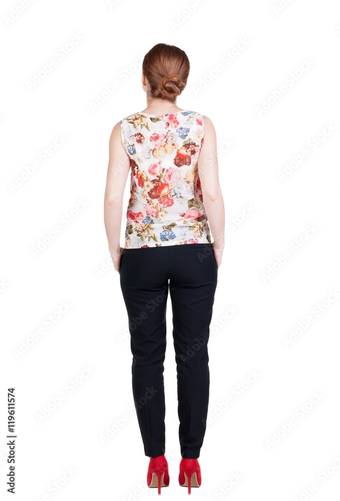 back view of standing young beautiful redhead woman. girl watching ...