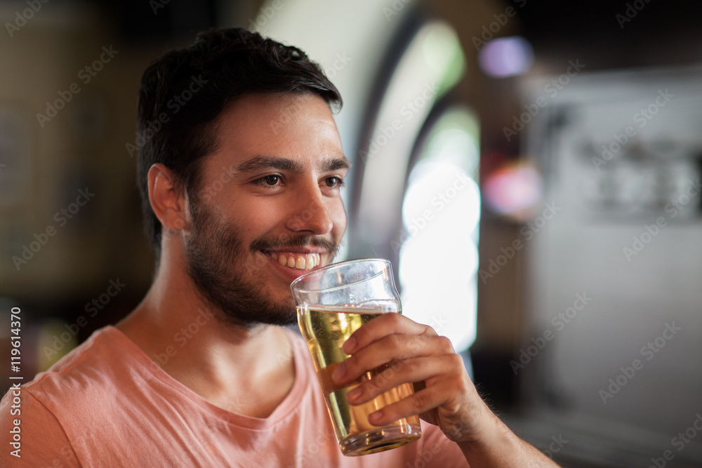 happy man drinking beer at bar or pub Stock Photo | Adobe Stock