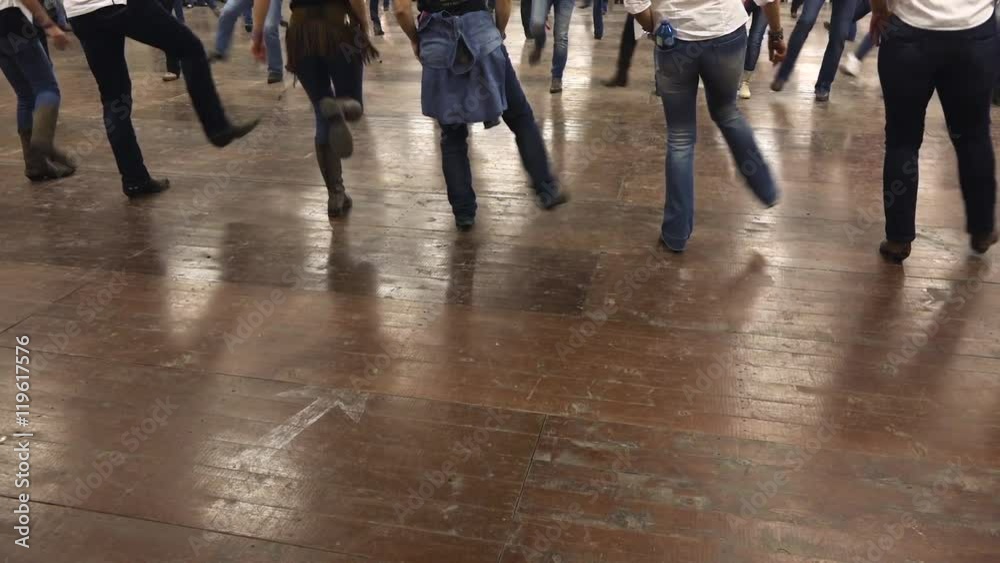 Legs of western dancers dancing a choreography at a country festival ...
