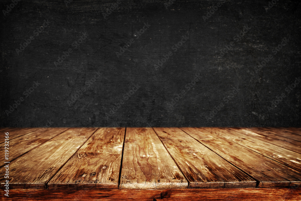 Old wood table with blackboard background - Empty ready for your ...