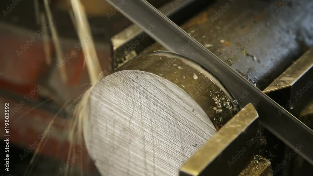 Contour bandsaw in the workshop.Band saw cutting metal, cooling ...
